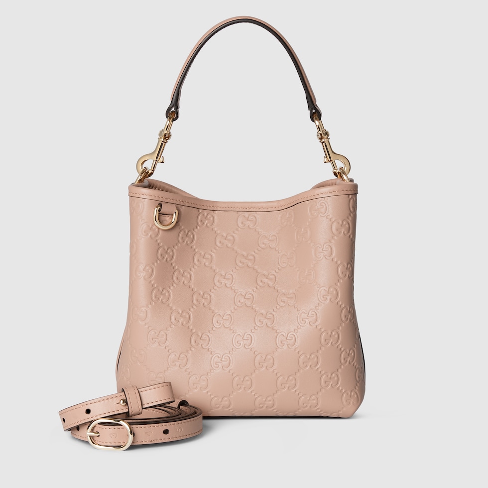 GG Emblem small bucket bag in pink beige GG leather | GUCCI® AU