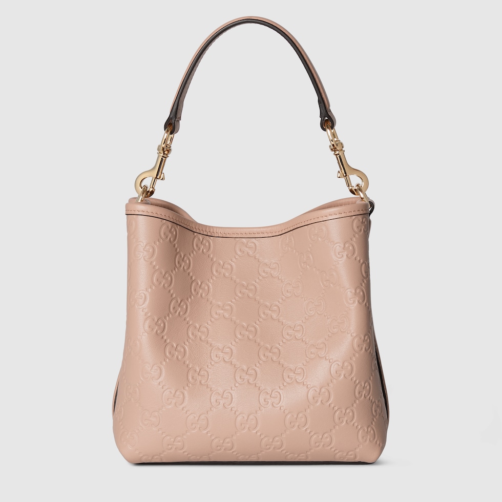 GG Emblem small bucket bag in pink beige GG leather | GUCCI® UK