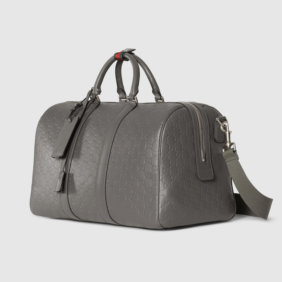 GG Emblem medium duffle bag in grey GG leather | GUCCI® CA