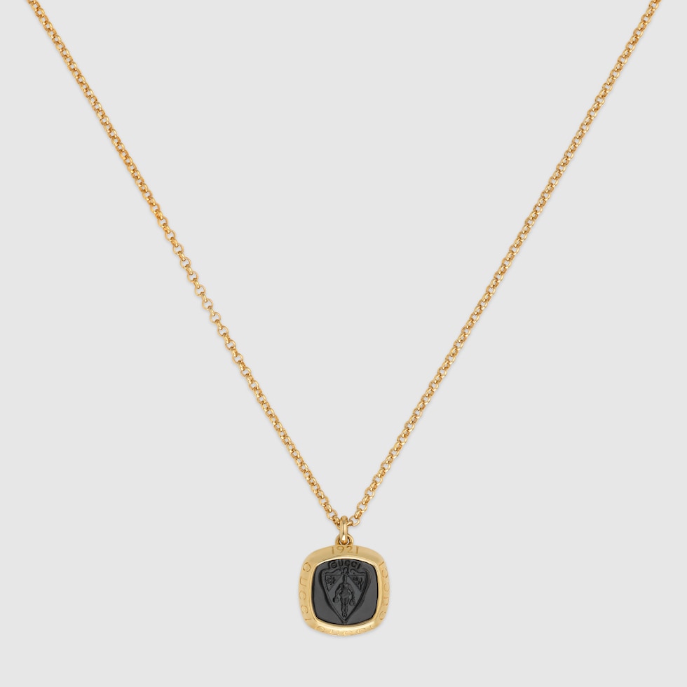 Gucci crest pendant necklace in gold-toned brass | GUCCI® ZA