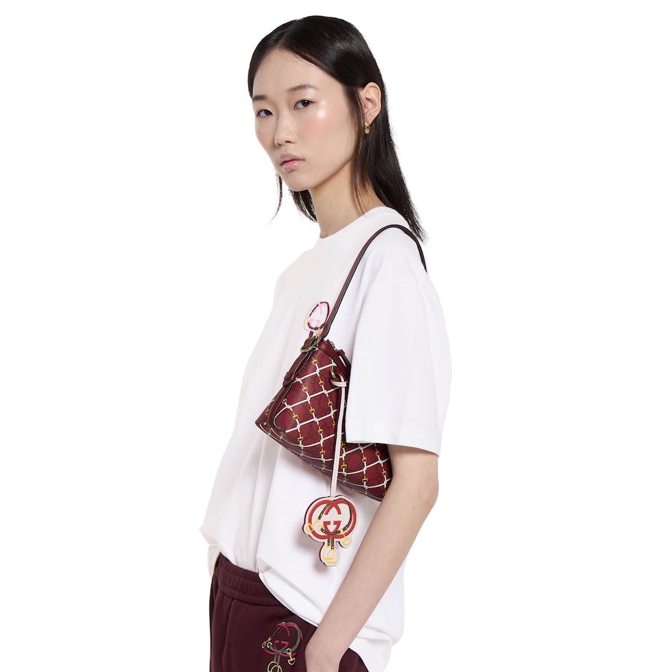 GG Emblem small shoulder bag in red and pink GG fabric | GUCCI® JP