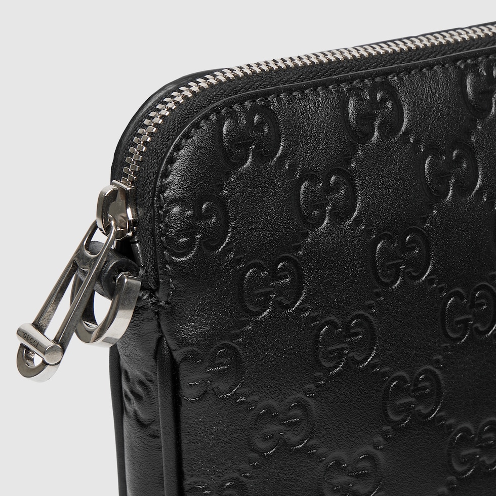 GG Emblem medium crossbody bag in black GG leather | GUCCI® US