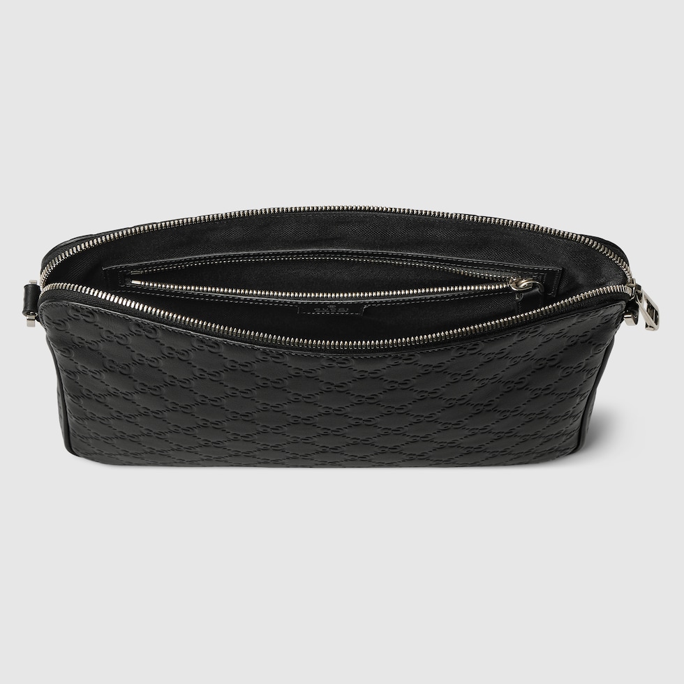 GG Emblem medium crossbody bag in black GG leather | GUCCI® US