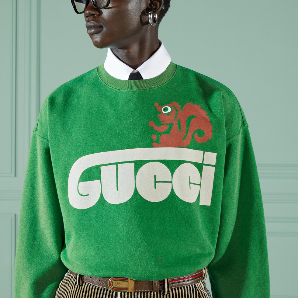 Retro Gucci skunk print sweatshirt in green | GUCCI® NO