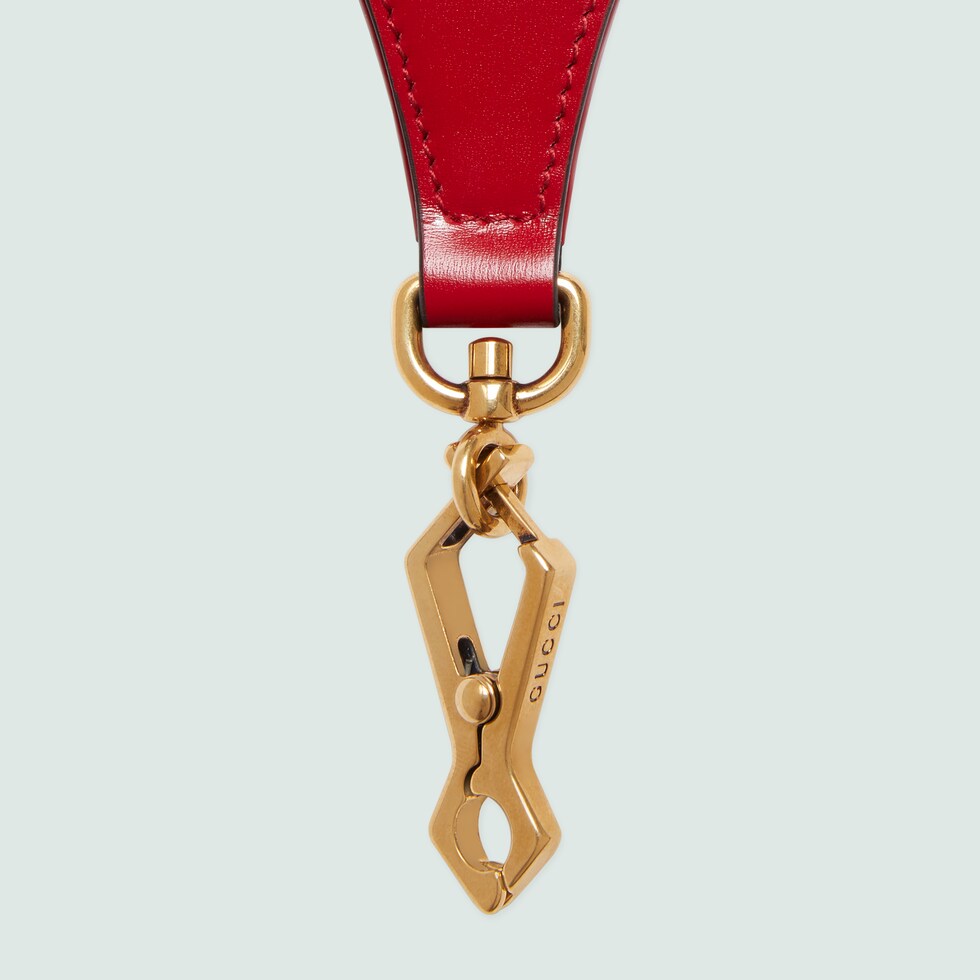 KW ®غوتشي |‎Shoulder strap with maxi eyelets in red leather