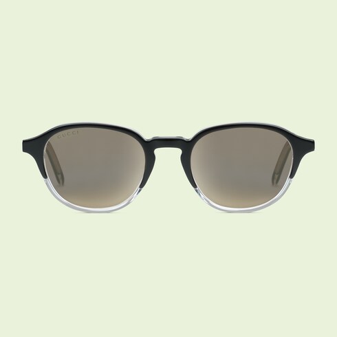 SA ®غوتشي |‎Round frame with photochromic lens in black acetate
