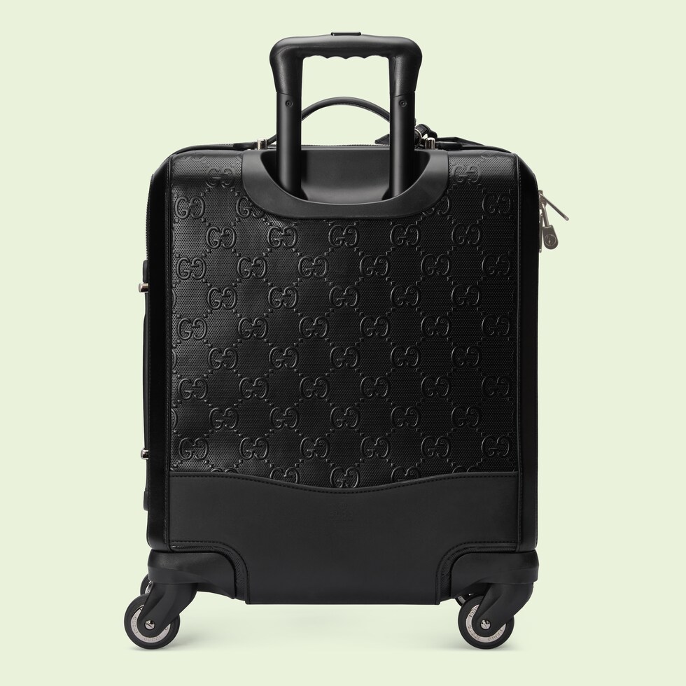 GG embossed carry-on in black leather | GUCCI® AE