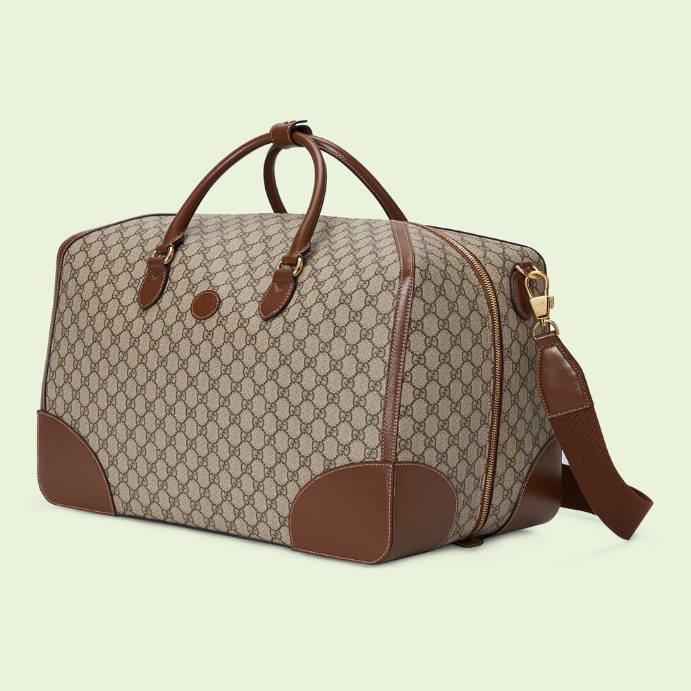 Large duffle bag with Interlocking G in beige and ebony GG Supreme ...