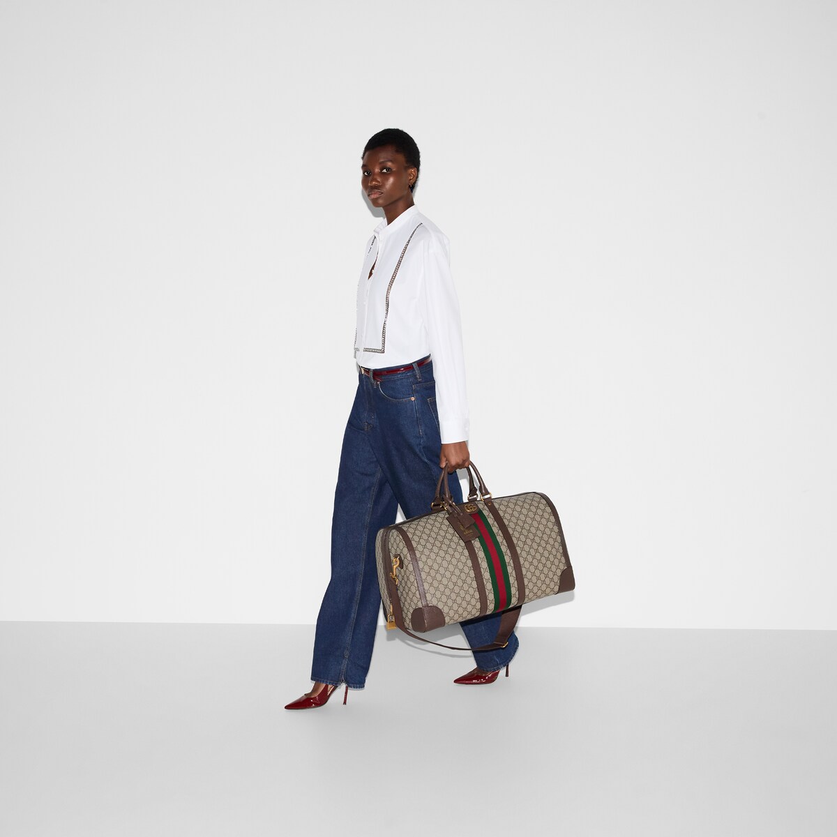 Gucci Savoy large duffle bag in beige and ebony Supreme | GUCCI® SI