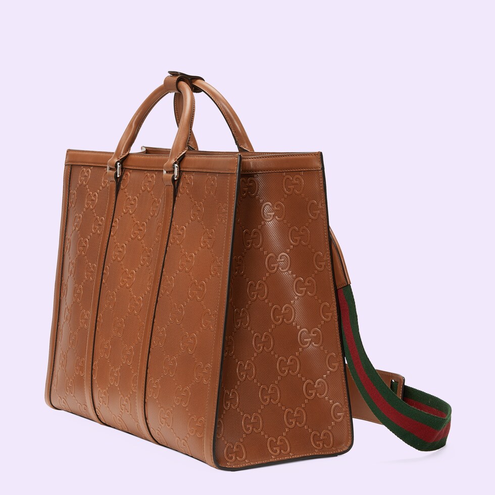 GG embossed tote bag in brown leather | GUCCI® AE