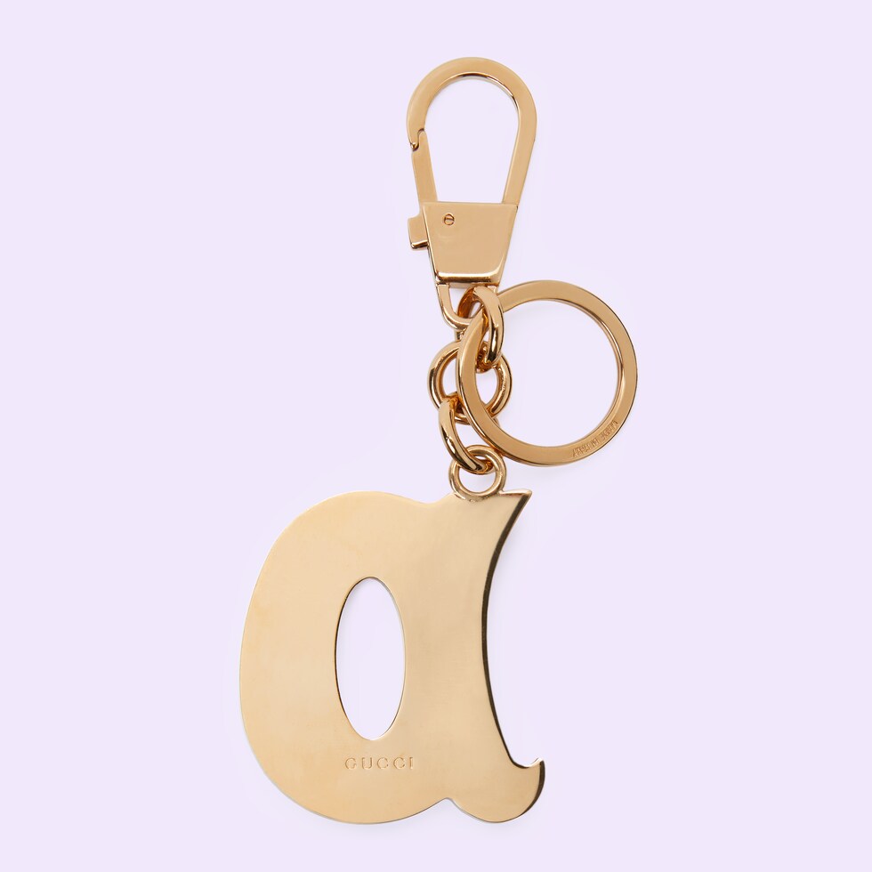 SA ®غوتشي |‎Letter D Plexiglas keychain in light purple and gold