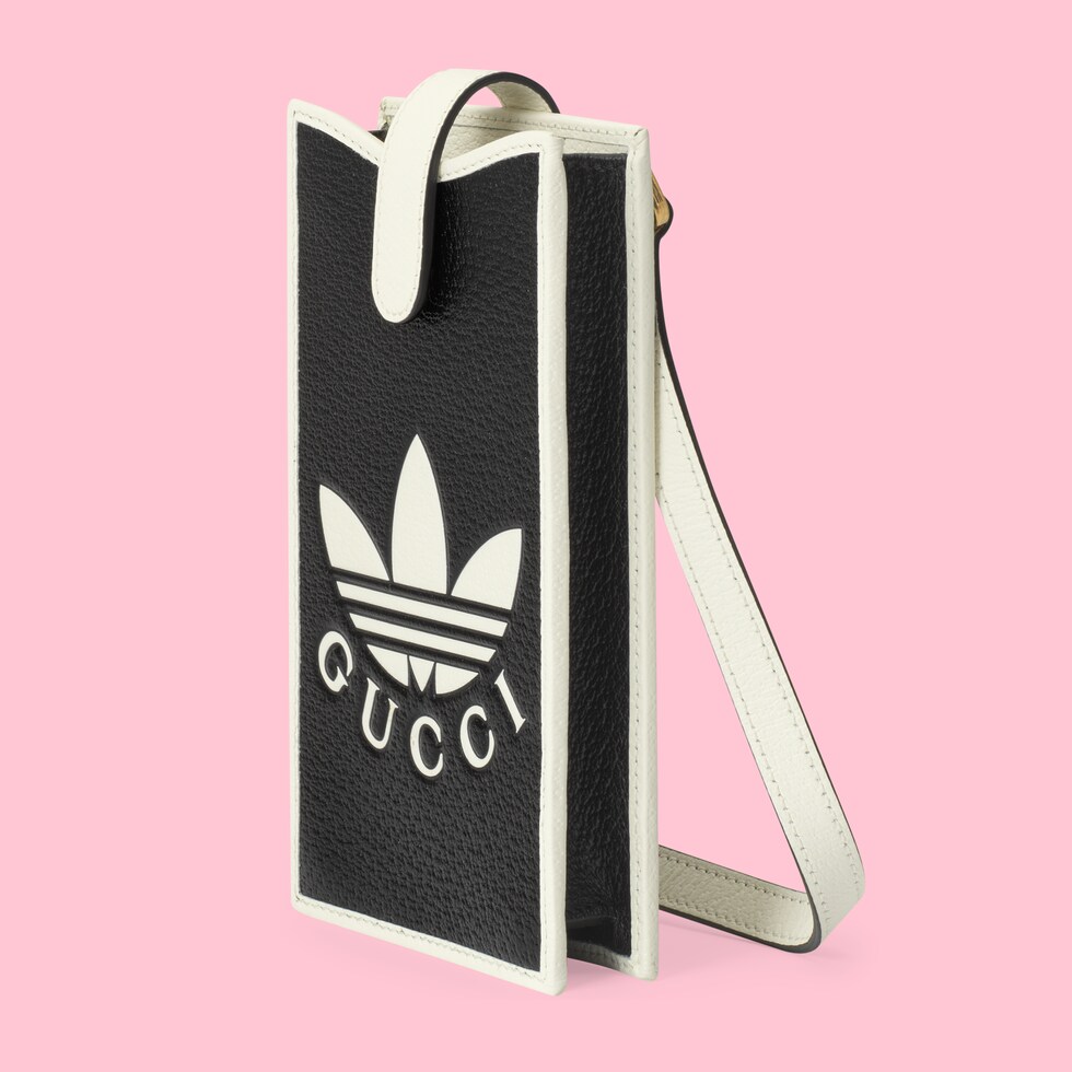 adidas x Gucci phone case in black and off-white | GUCCI® AE